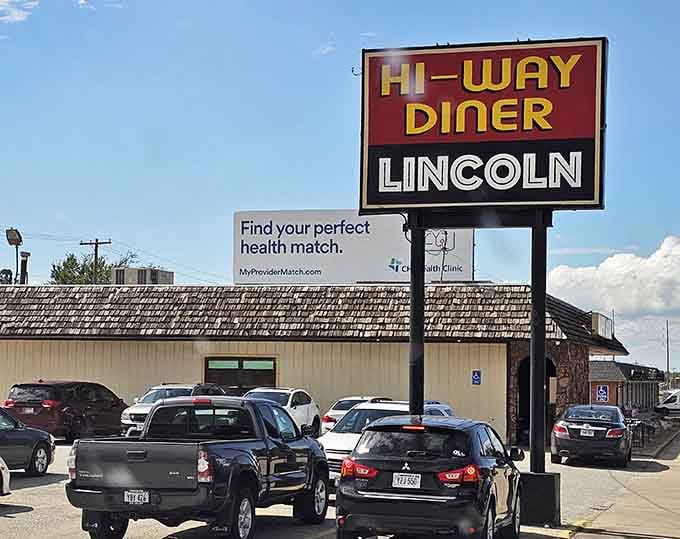 The classic roadside sign stands tall, promising comfort food that'll make you forget all about your diet resolutions.