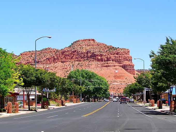 Kanab's tree-lined streets offer welcome shade and a touch of green against the dramatic desert backdrop.