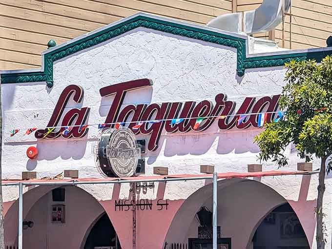 La Taqueria's classic white facade with distinctive arches – the architectural equivalent of "don't judge a book by its cover."