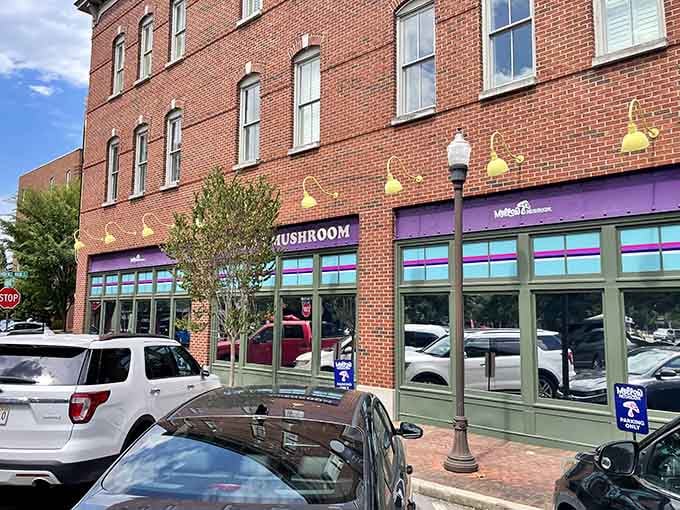 Mellow Mushroom's vibrant purple façade stands out like a creative rebel in Huntsville's Providence area. Funky outside, delicious inside!
