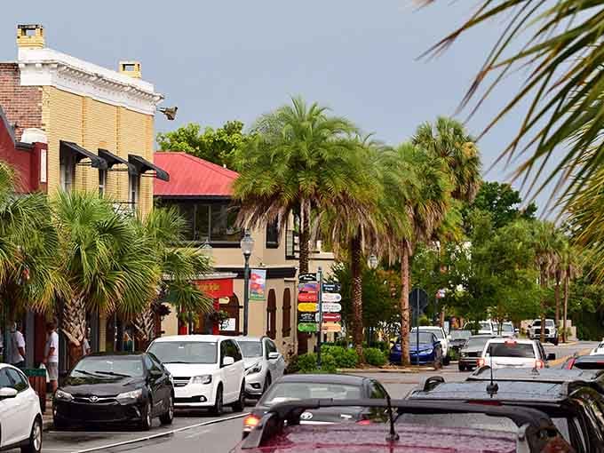 Lush tropical foliage frames colorful buildings along streets that look straight out of a Southern novel.