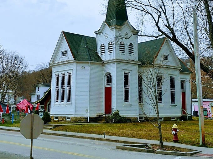 This white chapel with its green steeple looks like something from a Hallmark movie, picture-perfect and utterly charming.