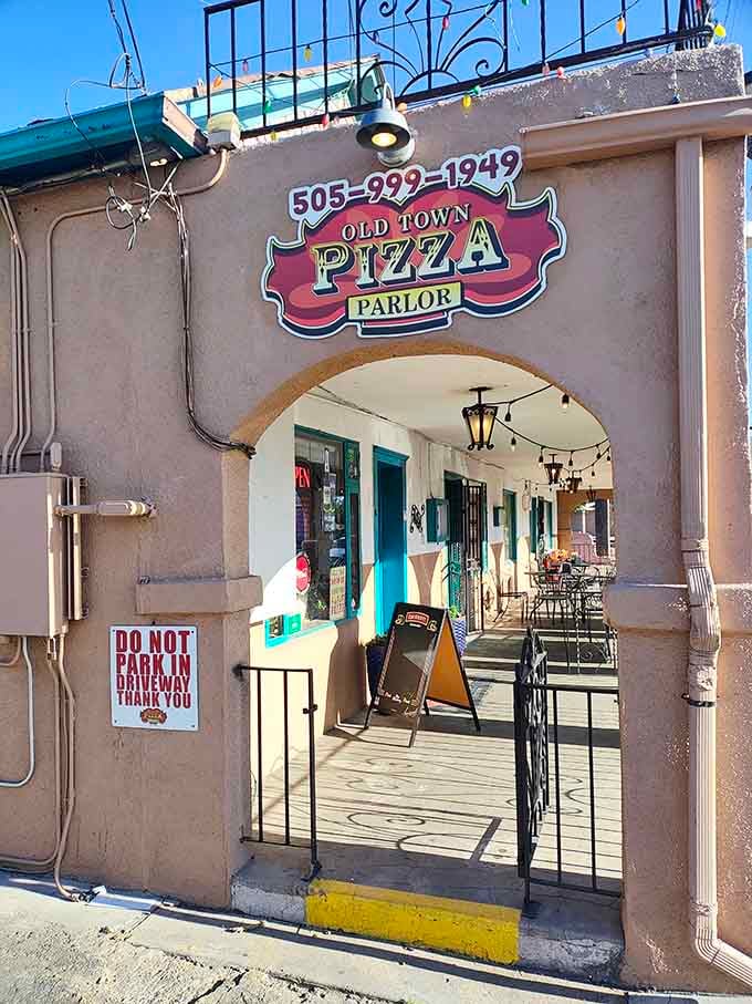 Adobe walls and arched doorways whisper "authentic" before you even taste the pizza.