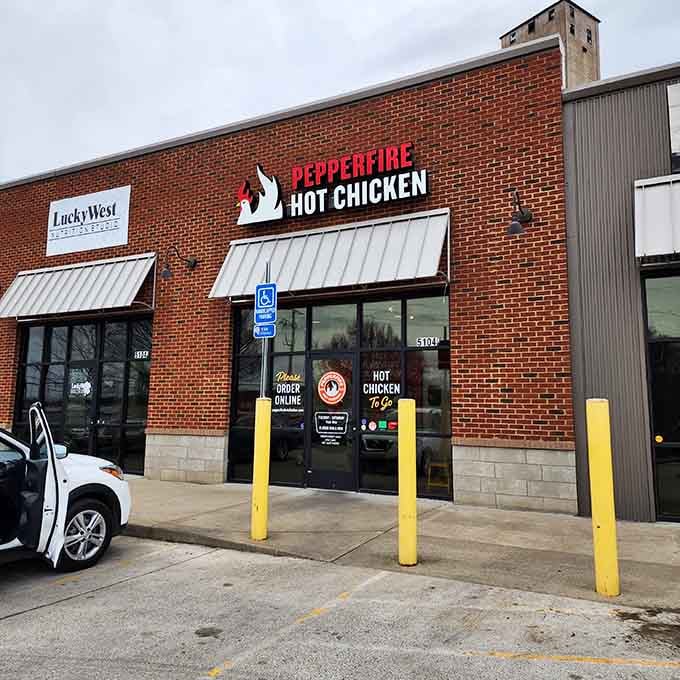 Behind this unassuming brick facade lies chicken so hot it should come with its own fire extinguisher.