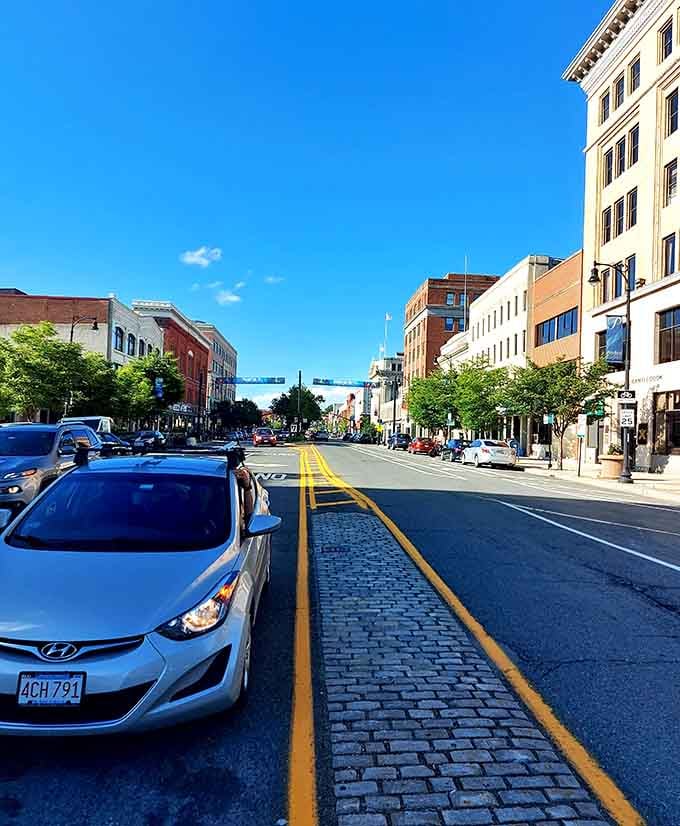 Blue skies stretch over cobblestone streets where history literally paves the way for your afternoon stroll through town.