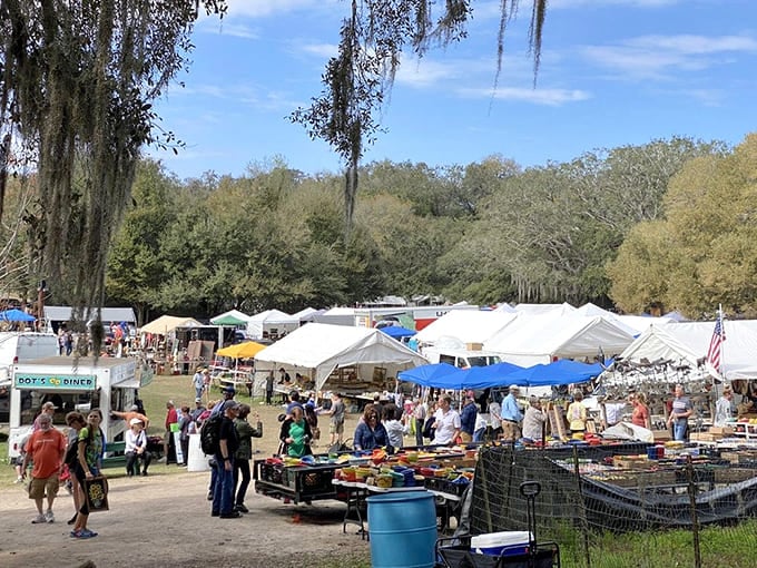 Spanish moss draping over white tents creates the most charming backdrop for serious treasure hunting adventures.
