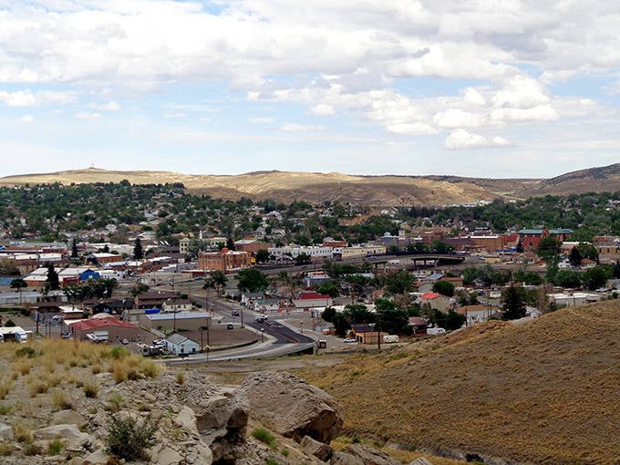 Rolling hills embrace this cozy community like a grandmother's quilt wrapping around her favorite grandchildren safely.