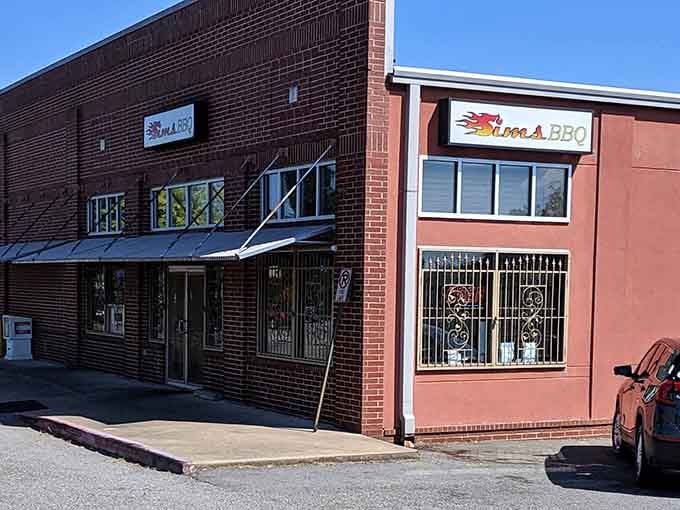 Sims Bar-B-Que's brick facade houses generations of smoking expertise. Behind those windows, pitmasters work the kind of magic that makes vegetarians question their life choices.