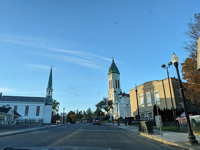 Church steeples punctuate the skyline, standing guard over streets that time hasn't completely forgotten.