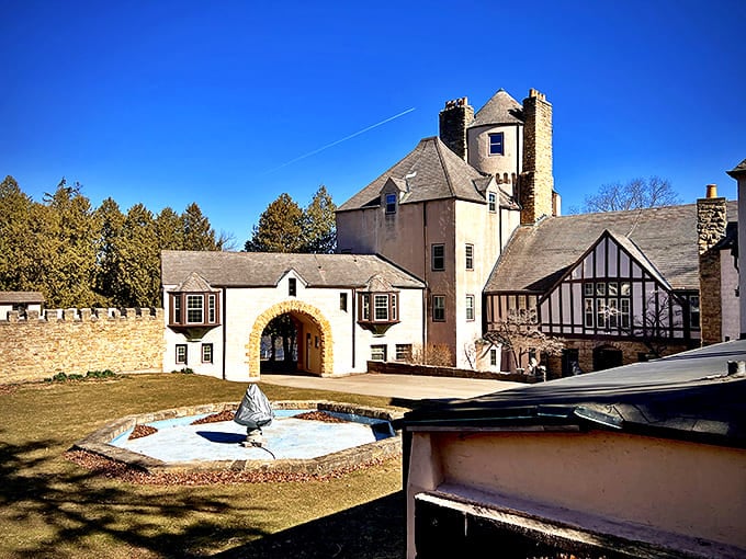 Stronghold Castle's stone walls and arched entrance create a medieval atmosphere perfect for retreats overlooking the Rock River.