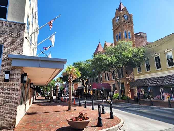 That clock tower stands proud like a town elder, watching over brick streets where retirement dreams become reality.
