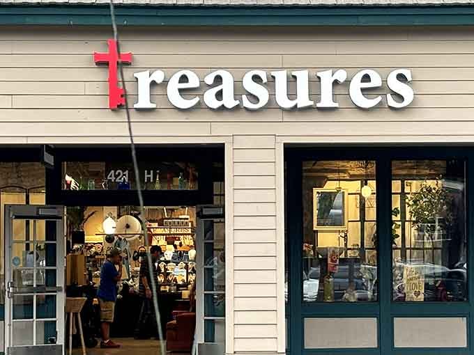 The charming storefront practically whispers "hidden treasures inside" with its welcoming windows displaying furniture and home goods galore.