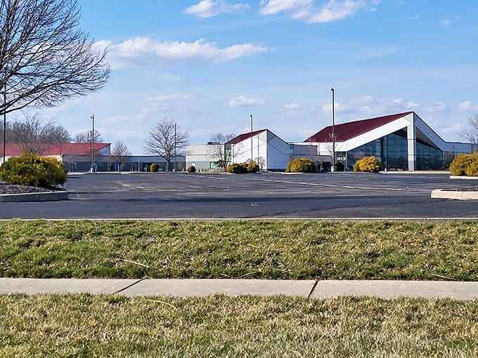Modern community buildings blend seamlessly with green lawns, creating spaces where neighbors gather and connections flourish.