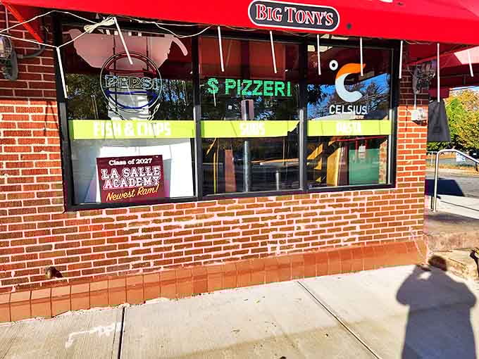 That red awning practically waves you over, promising authentic flavors and neighborhood charm inside.