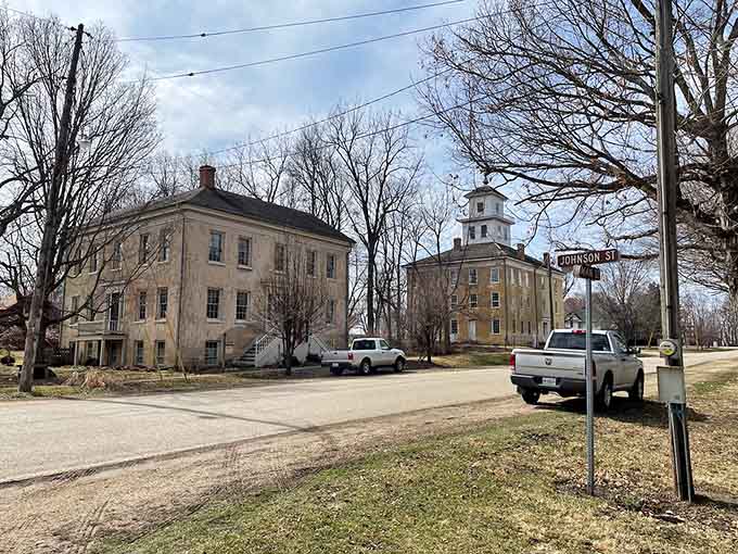 Winter trees reveal the bones of these historic structures, standing dignified even in the coldest months of the year.