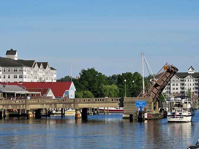 The drawbridge rises like a scene from your favorite coastal movie, connecting neighborhoods across peaceful marina waters.