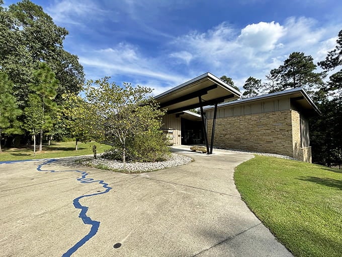 Modern architecture meets natural beauty here, where clean lines and stone walls frame the wilderness like a picture-perfect postcard scene.