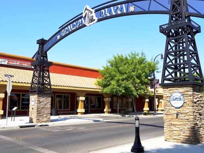Those oil derrick towers frame Coalinga's plaza entrance like industrial sculptures, celebrating the town's hardworking heritage with style.