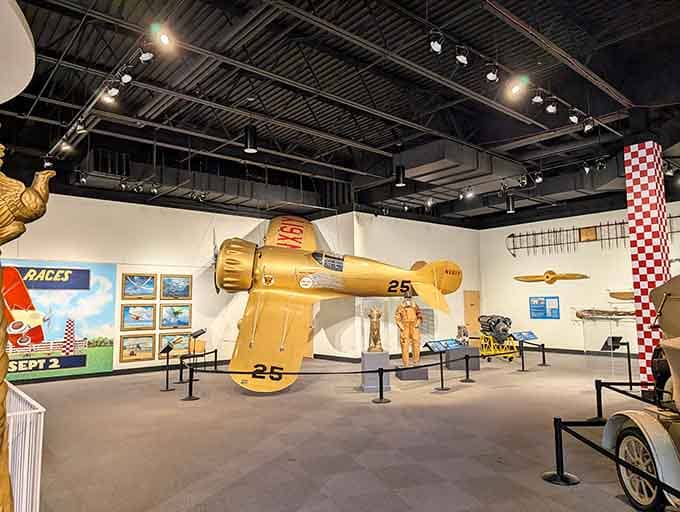 That golden racer suspended mid-flight captures the daredevil spirit when barnstormers were basically rock stars with propellers.