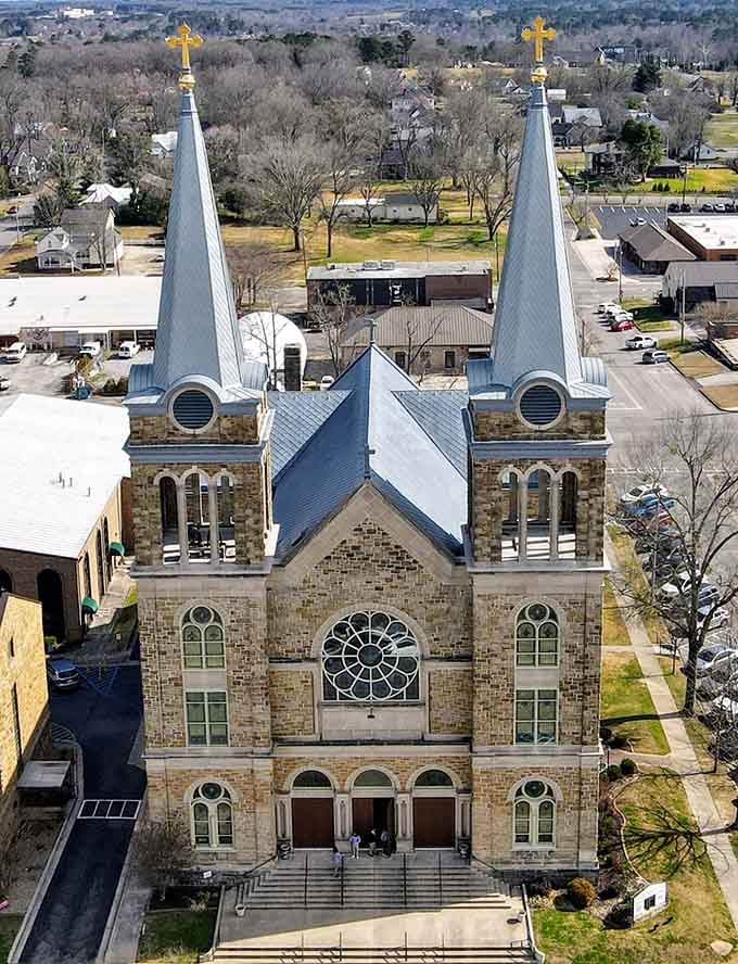 Twin spires reach skyward above stone walls, a testament to craftsmanship that modern builders can only admire.