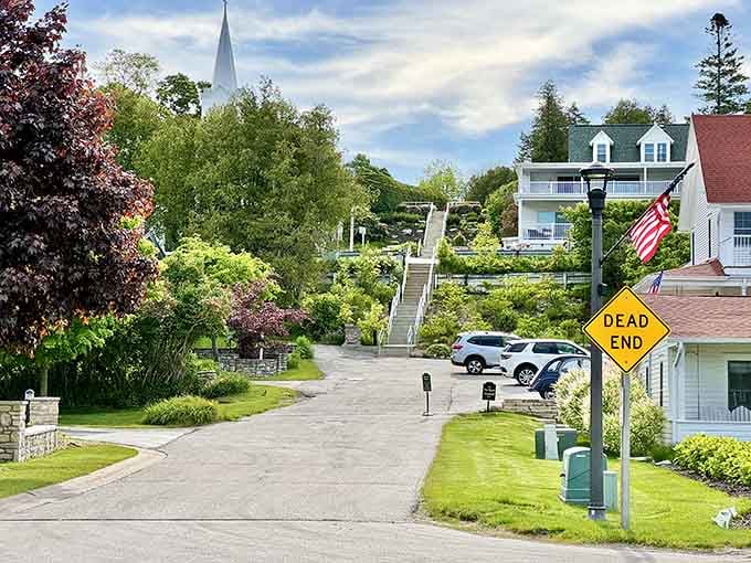 Lush greenery frames white buildings that seem to glow against the summer landscape, pure Door County magic.