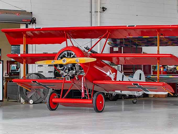 This crimson triplane looks like it flew straight out of a Snoopy cartoon into glorious three-dimensional reality.
