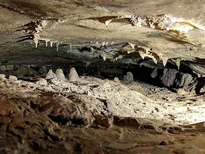 Those delicate stalactites hanging overhead took centuries to form, one tiny drip at a time.