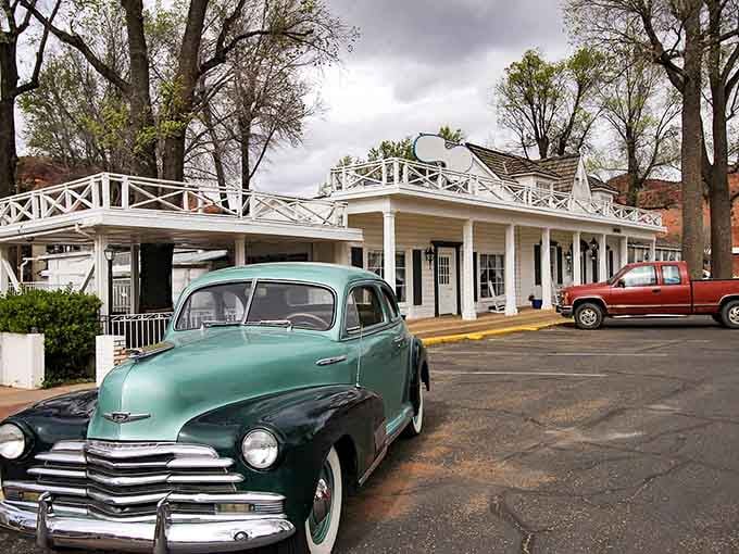 A vintage car rests outside Kanab's classic buildings, like a time machine ready to transport you to Western movie days.