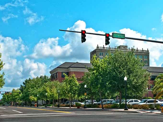 Fluffy clouds drift over downtown Lakeland where historic buildings stand tall like proud sentinels of a bygone prosperity.