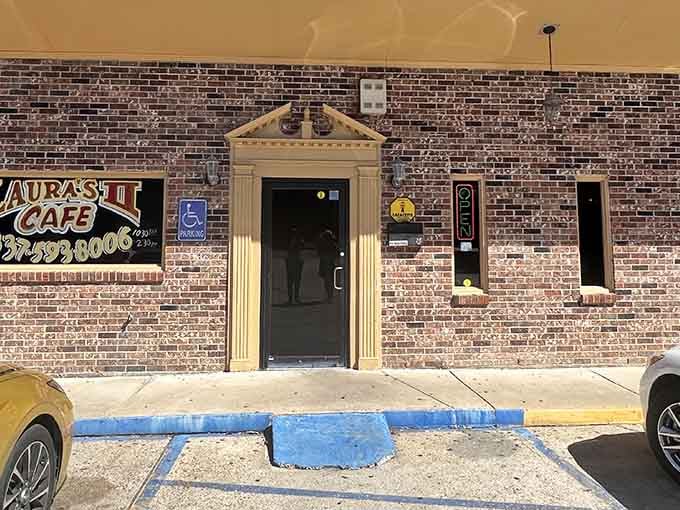 That yellow-trimmed doorway? Consider it a portal to some of Lafayette's most soul-satisfying comfort food.