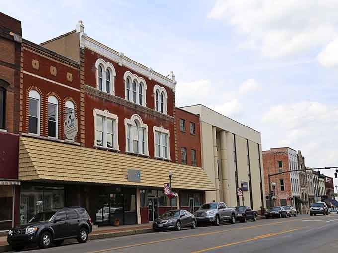 These classic storefronts along Madisonville's main drag aren't just pretty facades—they're the backbone of a community where neighbors still greet each other by name.