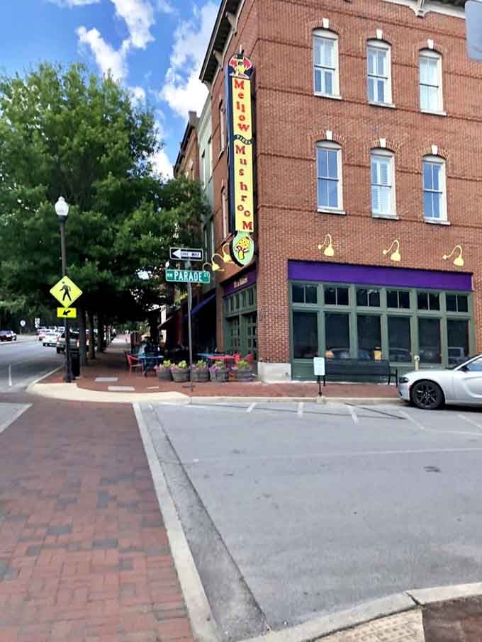 The vertical "Mushroom" sign beckons pizza lovers like a psychedelic lighthouse. This isn't your average chain restaurant experience!