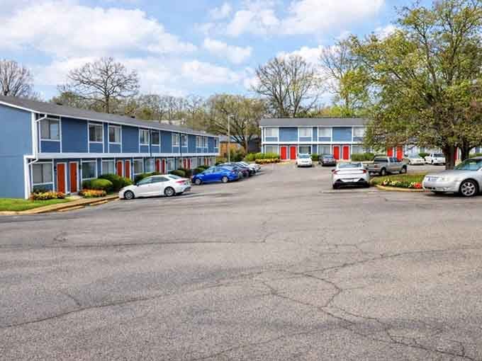 Affordable apartment living with pops of orange doors proves home doesn't have to cost a fortune.