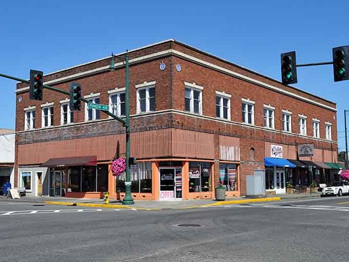 Corner storefronts in warm brick welcome neighbors and strangers alike with genuine small-town hospitality and charm.