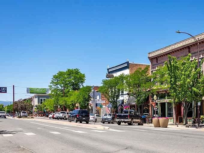 Wide streets and leafy trees frame this downtown where neighbors still wave from their pickup trucks.