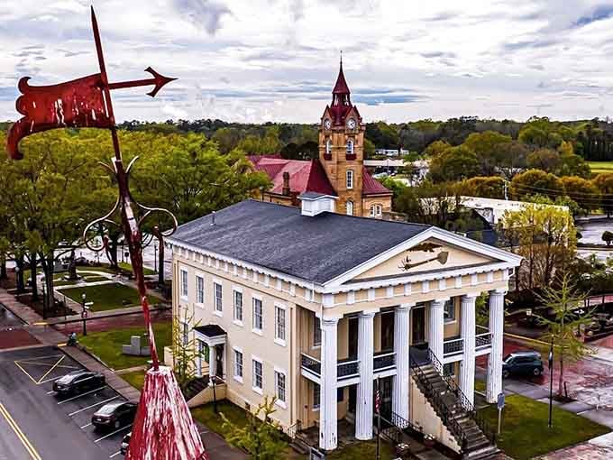 Classical columns and a clock tower rise above the trees, reminding us that some architecture never goes out.