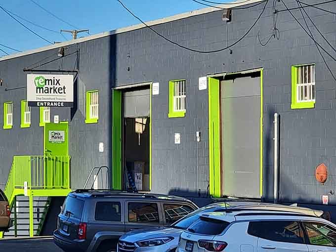 Industrial-chic meets sustainable shopping where those lime-trimmed windows peek out like eyes watching over vintage treasures inside.
