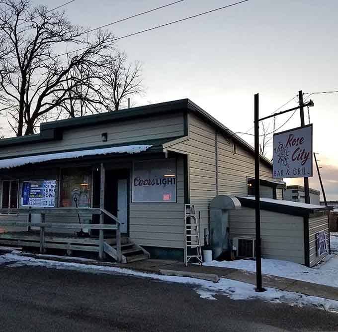 That Coors Light sign glowing at dusk signals good times and great food ahead for winter-weary travelers.