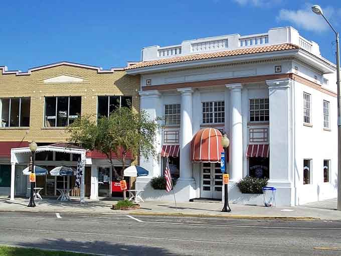 Classic white columns frame a building that looks ready for its close-up in any Southern heritage magazine.