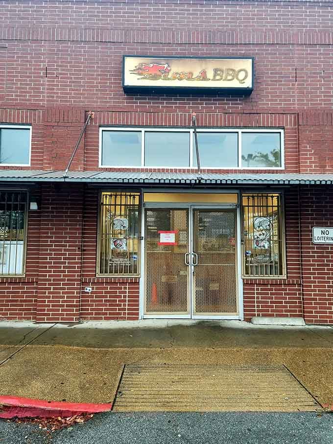 That classic BBQ joint sign promises what's inside - no frills, just thrills for your taste buds. The mesh door practically whispers "come get some."