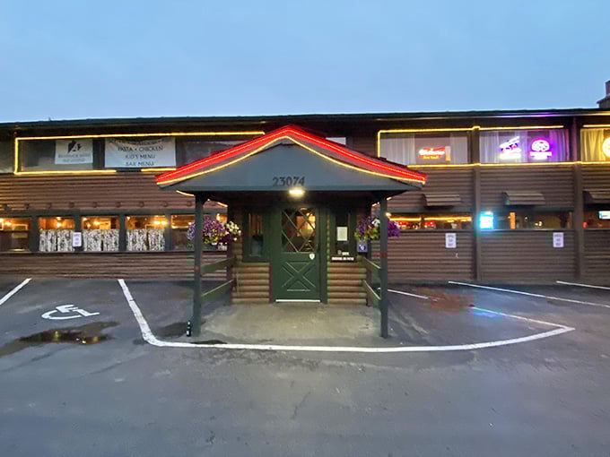 Evening falls on this mountain steakhouse where the lit entrance beckons like a beacon for hungry skiers and hikers.