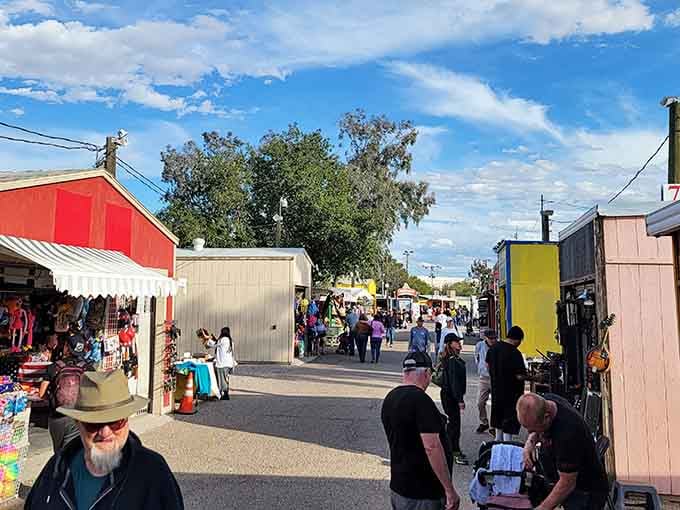 That perfect blue sky frames an outdoor market where community and commerce meet in delightful harmony.