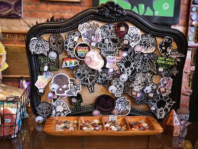 That ornate black frame covered in skull pins and patches is basically wearable art for the alternative soul.