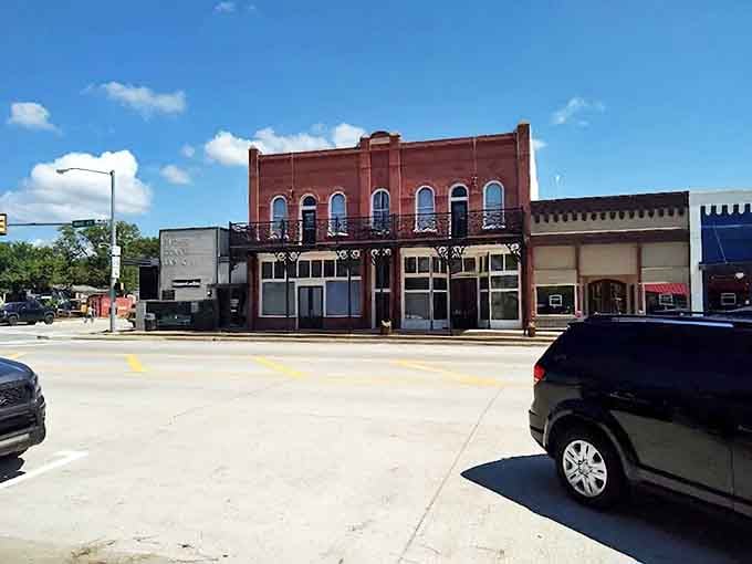 Tishomingo's buildings catch the afternoon light on streets where parking is always available right out front.
