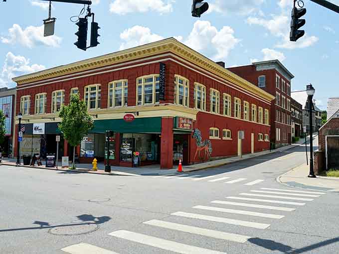 This classic corner building wears its red brick like a badge of honor, anchoring downtown with character and unpretentious beauty.