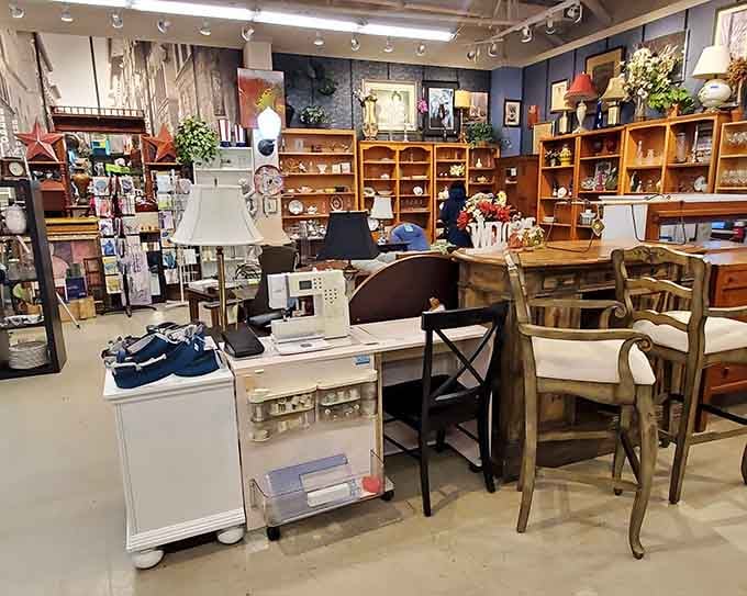 Inside, wooden shelves and carefully arranged displays create a boutique atmosphere that makes thrifting feel downright sophisticated and fun.