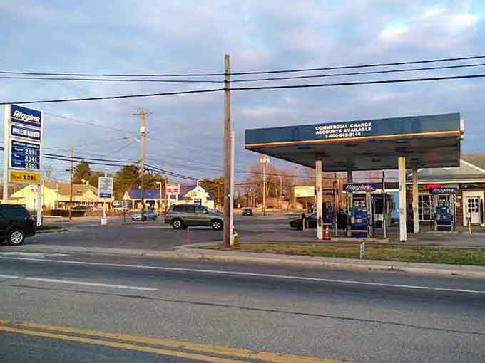 Classic American roadside scene at dusk, where gas stations and power lines create their own kind of nostalgic beauty.