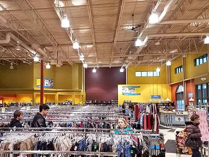 Fellow treasure hunters navigate the aisles with the focus of archaeologists on the verge of a major discovery.