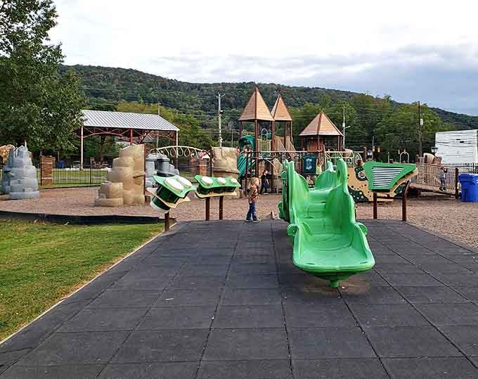 This playground sits where mountains meet sky, reminding grandparents that the best entertainment for visiting grandkids doesn't require batteries or Wi-Fi.