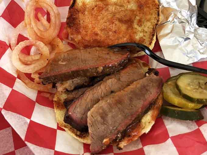 Brisket with a smoke ring that beautiful deserves its own gallery opening, preferably in your mouth right now.